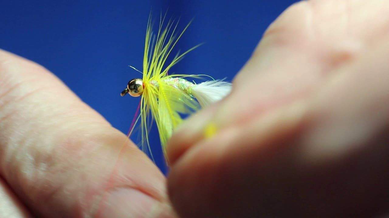 Solve tying a yellow dancer - fly fishing jigsaw puzzle online with 60 ...