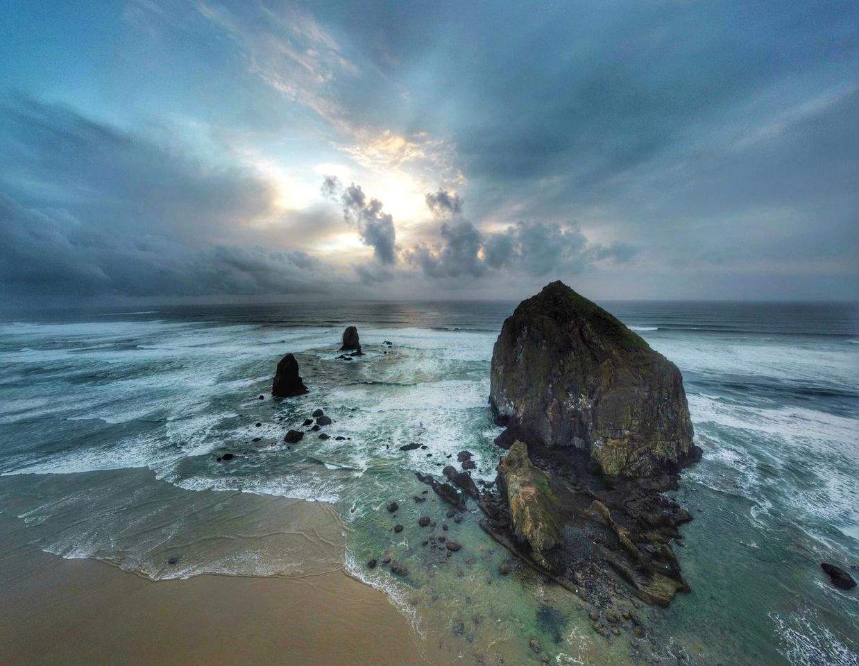 Solve SKY WINDOW OVER HAYSTACK ROCK, OR jigsaw puzzle online with 192 ...