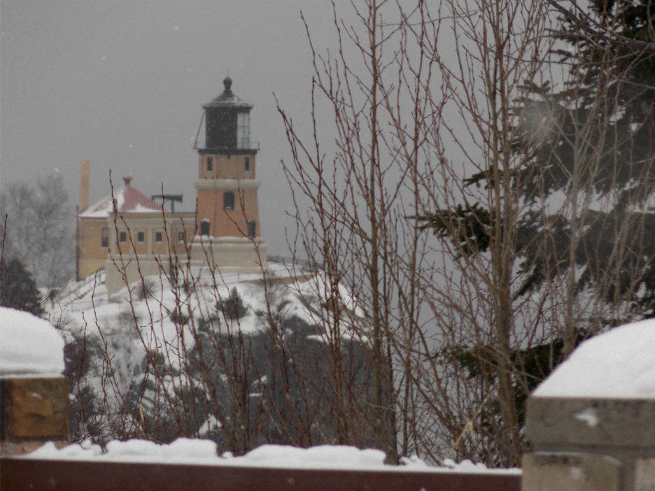 Solve Split Rock lighthouse (MN) on a snowy day jigsaw puzzle online ...