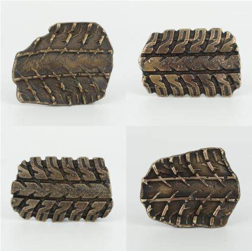 Solve Bronze buckles Tires & Tracks jigsaw puzzle online with 64 pieces