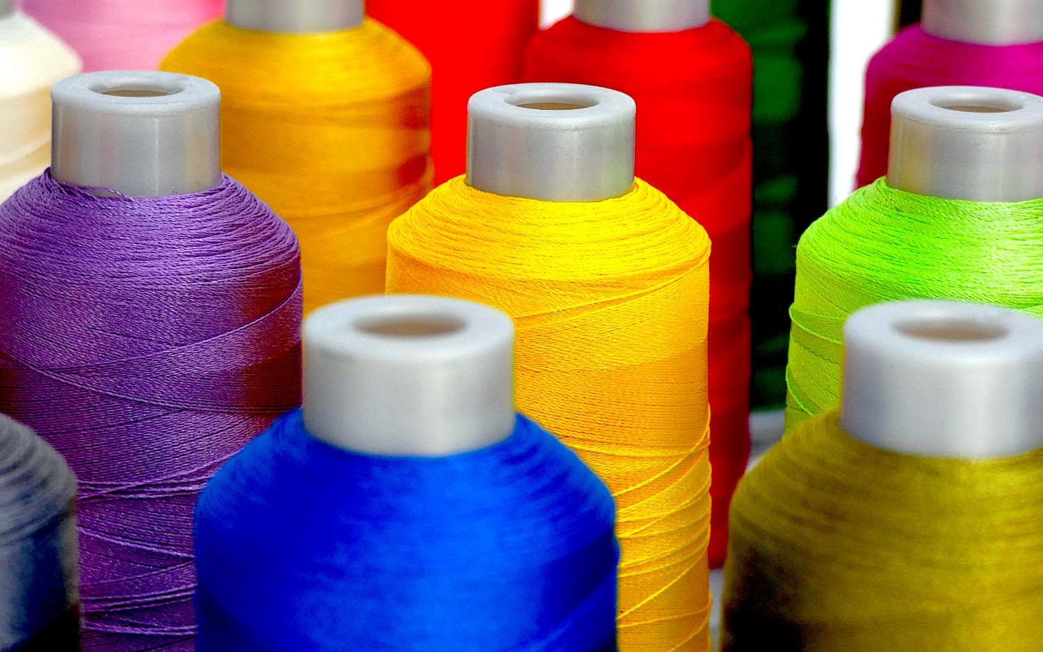 Solve Close-Up of Assorted-color Thread Spools jigsaw puzzle online ...