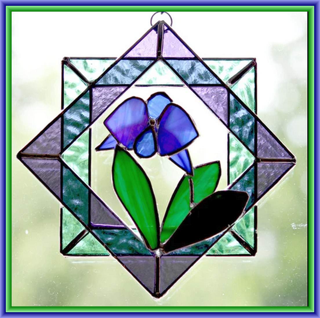 Solve Pretty stained glass window panel jigsaw puzzle online with 49 pieces